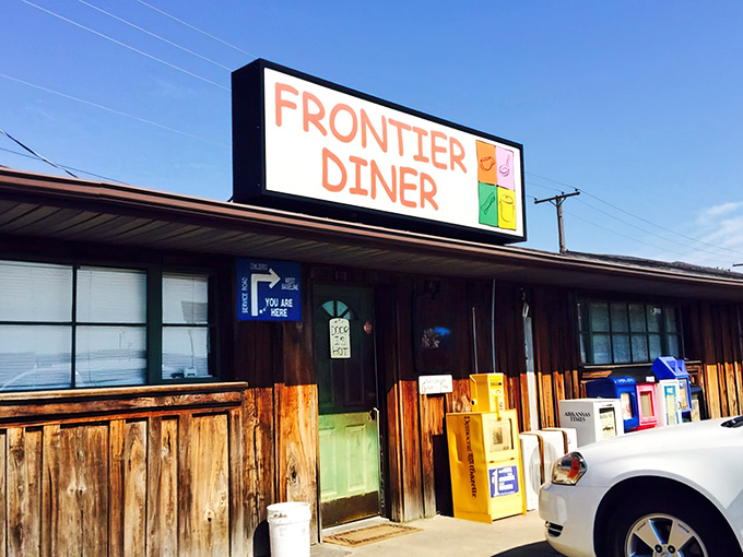 The unassuming exterior of Frontier Diner might not scream "culinary destination," but those pickup trucks don't lie—locals know where the good stuff is.