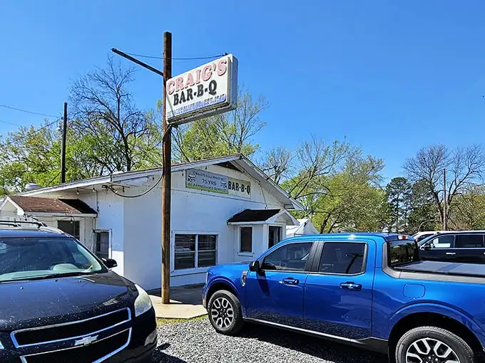 The unassuming white building with its vintage sign promises more than meets the eye. Barbecue pilgrims know: the humbler the exterior, the better the meat inside.