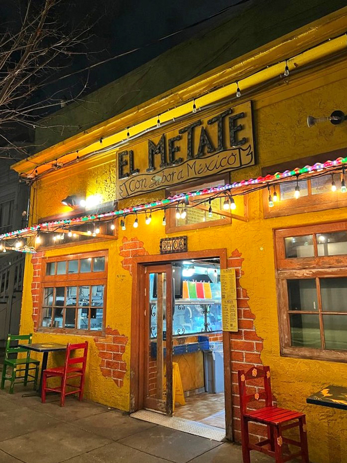 That sunshine-yellow exterior isn't just a building—it's a mood-altering device that says "happiness served daily." The colorful chairs outside are just a preview of the fiesta within.