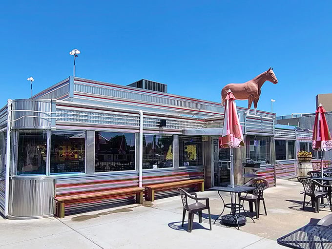 That iconic neon cowboy isn't just showing you where to eat – he's been inviting hungry travelers to pull over since Eisenhower was president.