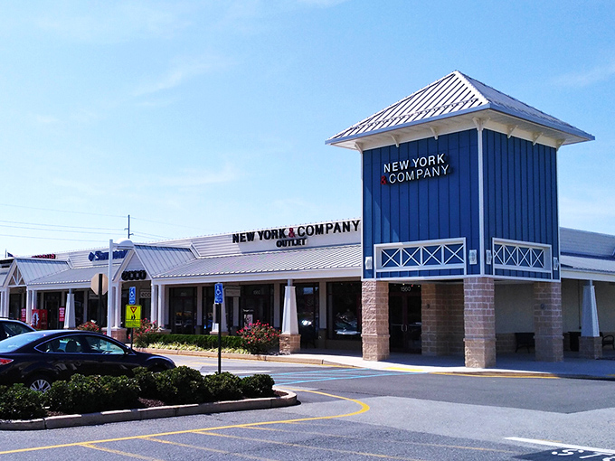 The iconic lighthouse-topped GUESS storefront welcomes shoppers like a beacon of bargains. Coastal charm meets retail therapy in this architectural gem.