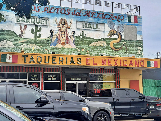 The vibrant mural above Taquerias El Mexicano isn't just decoration—it's a promise of the authentic flavors waiting inside this Little Havana landmark.