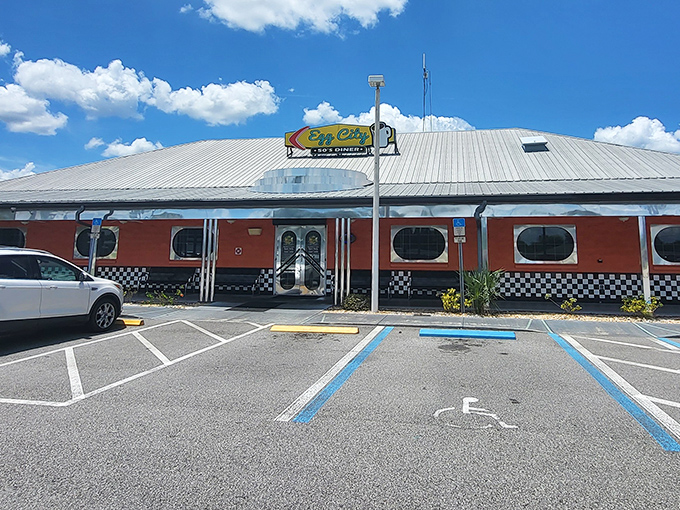 The vibrant orange exterior with its classic checkered trim isn't just eye-catching—it's a beacon of breakfast hope for hungry travelers on Florida's highways.