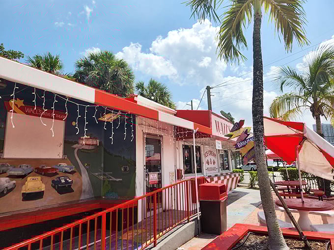 The classic red and white exterior of Wall's beckons like a sweet mirage under swaying palms, promising frozen salvation from Miami's relentless sunshine.