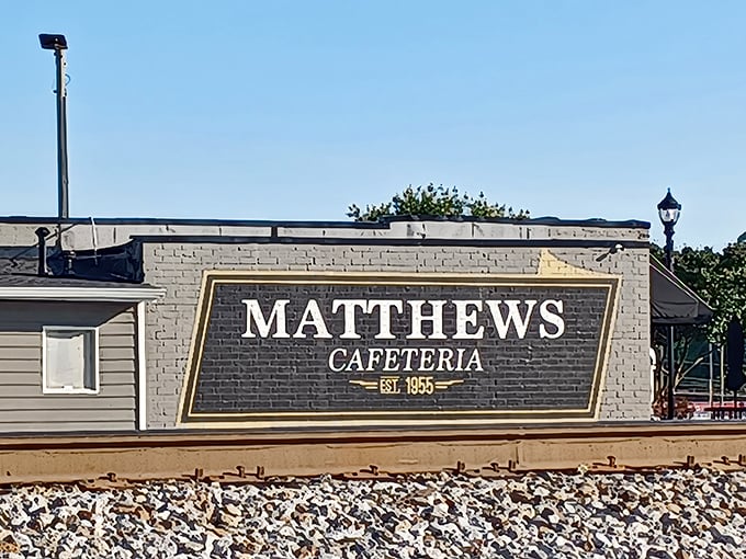 The classic black and white awning at Matthews isn't just a shelter – it's a beacon of hope for hungry souls seeking Southern salvation.