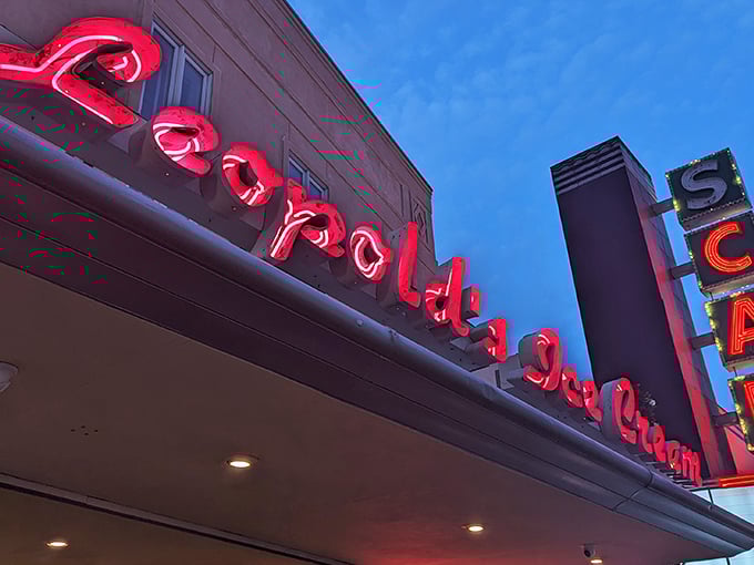 The iconic Leopold's marquee beckons like an old friend. That red neon sign isn't just advertising—it's promising happiness by the scoop.