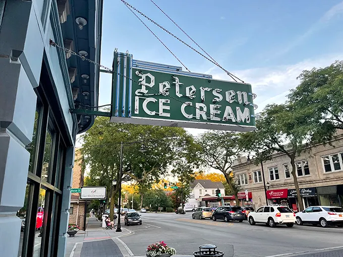 That neon sign doesn't just advertise ice cream—it's a beacon of hope on a tough day and a promise of something wonderful around that curved corner entrance.