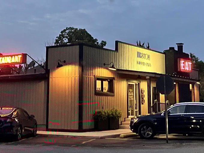 That iconic red "EAT" sign isn't just an invitation – it's a command from the food gods that locals have happily obeyed for generations at this brick-clad treasure.
