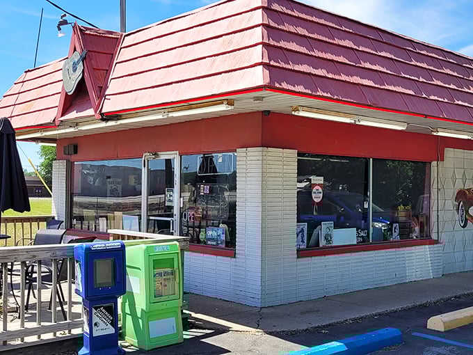 The classic red-roofed exterior of Rock-Cola 50's Cafe promises a time warp before you even step inside. That vintage Corvette mural isn't just decoration—it's a preview of coming attractions.