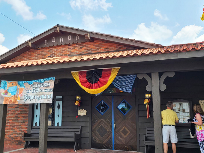 The Bavarian-style exterior of Schnitzelbank isn't just architectural flair—it's your first clue that authentic German goodness awaits inside. The clock tower practically screams "time for pretzels!"