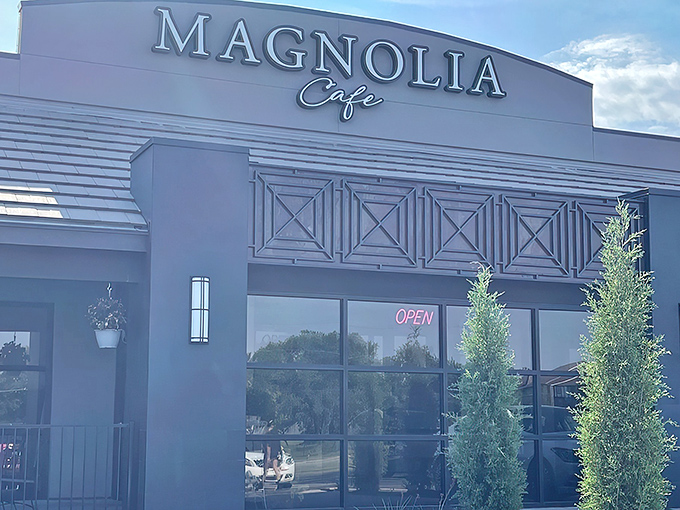 The sleek gray exterior of Magnolia Cafe stands like a culinary beacon in Wichita, promising delicious adventures within. That evergreen isn't just decoration—it's your first hint of the freshness awaiting inside.
