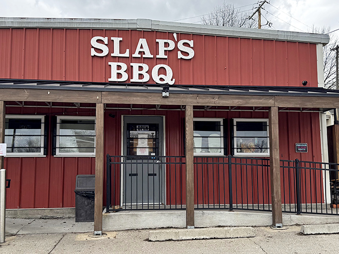 The brick exterior of Slap's BBQ stands like a temple to smoked meat, promising delicious secrets within its unassuming walls.