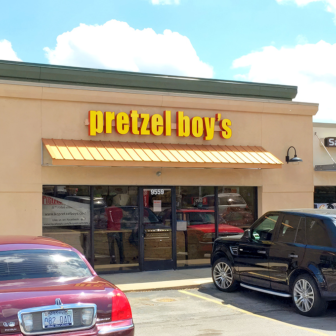 The bright yellow sign of Pretzel Boy's beckons like a carb-loving lighthouse, promising twisted delights within this Overland Park storefront.
