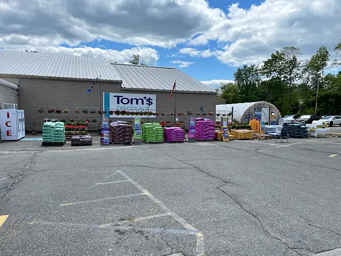 The unassuming exterior of Tom's Discount Store – where retail magic happens without the fancy wrapping. Bargain paradise awaits!