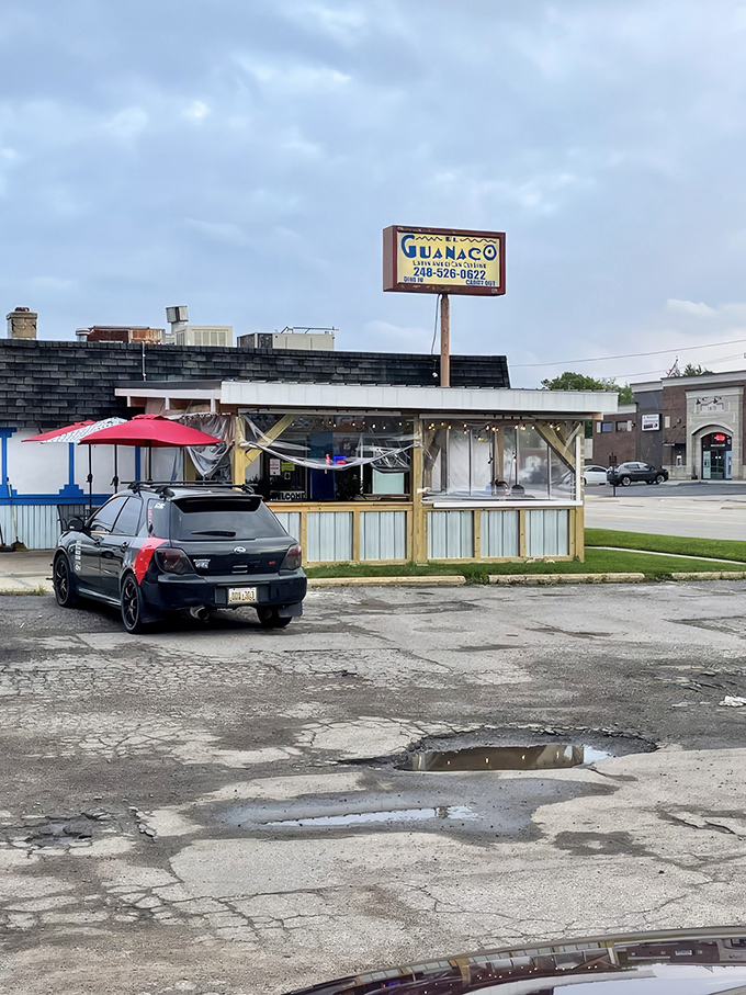 The unassuming exterior of El Guanaco might not stop traffic, but trust me—what happens inside this blue-trimmed building will stop your taste buds in their tracks.