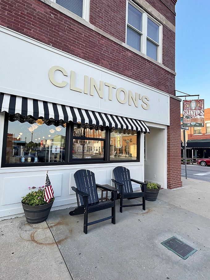 The classic storefront beckons with its vintage charm—Clinton's iconic awning and cozy outdoor seating invite you to step back in time on Independence Square.