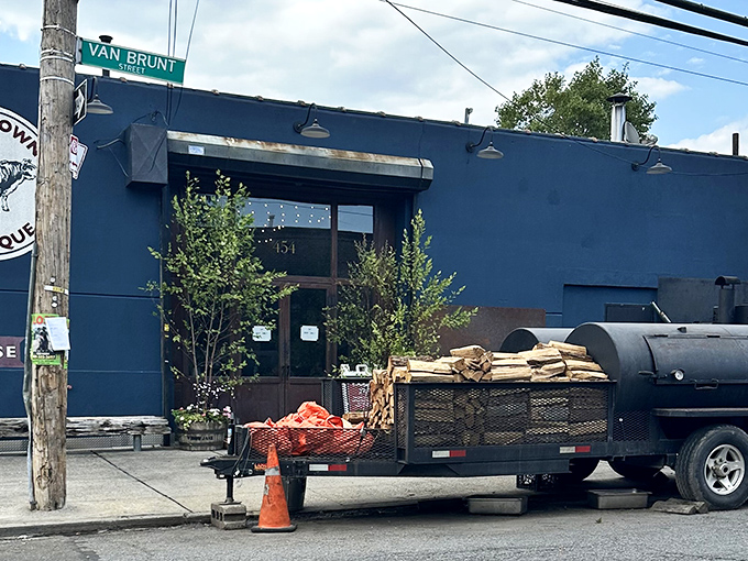 The blue exterior with its vintage cow logo isn't just a restaurant front—it's a beacon of smoke-scented hope for barbecue pilgrims seeking meaty salvation. 