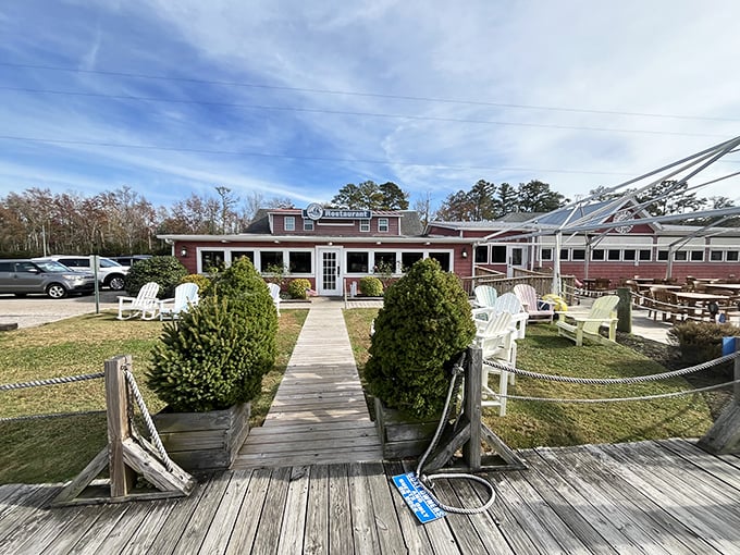 The unassuming pink exterior of Coinjock Marina Restaurant—proof that culinary treasures often hide in plain sight along North Carolina's waterways.