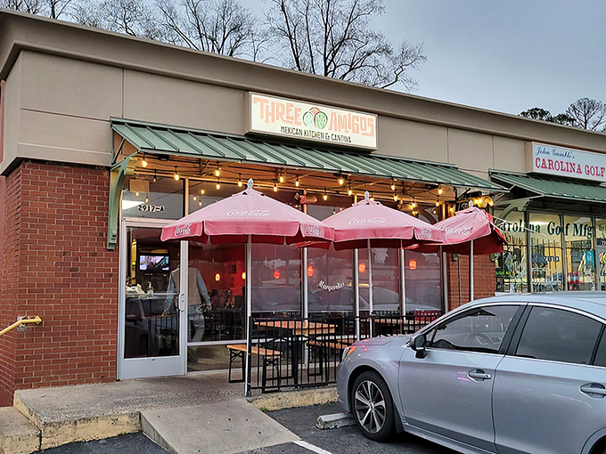 The vibrant mural outside Three Amigos sets the tone – authentic Mexican cuisine lives behind this unassuming brick façade in Charlotte. 