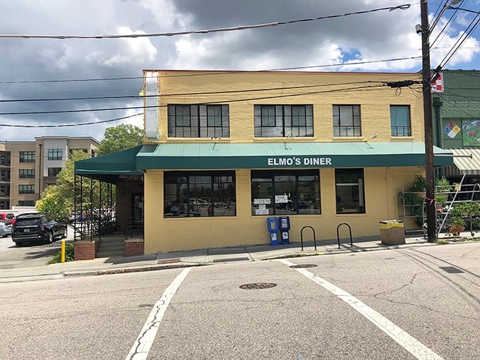 The unassuming yellow exterior of Elmo's Diner stands like a beacon of breakfast hope on Durham's Ninth Street, promising comfort within its walls.