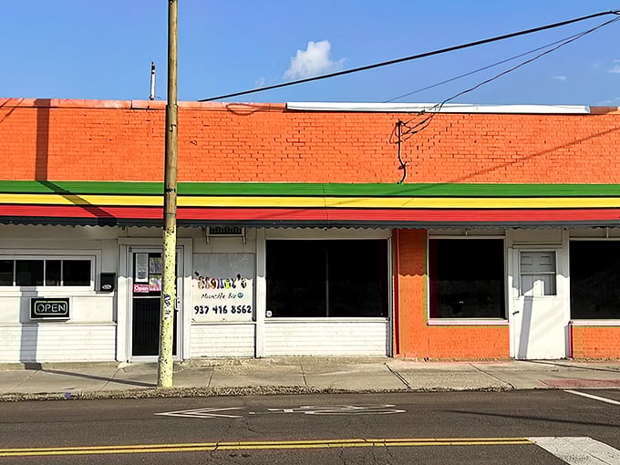 The unassuming brick exterior with its vibrant Jamaican-inspired trim is like a culinary treasure map – X marks the spot where flavor lives.