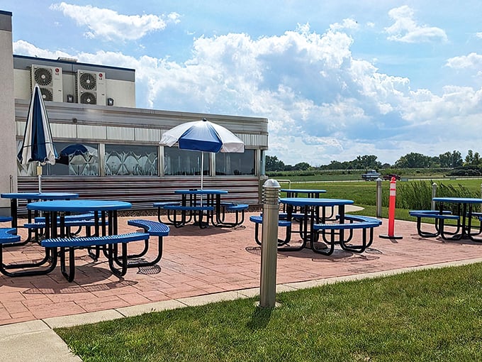 The perfect pit stop awaits! Blue picnic tables dot the patio where diners can enjoy their meals with a side of aviation views and Ohio sunshine.