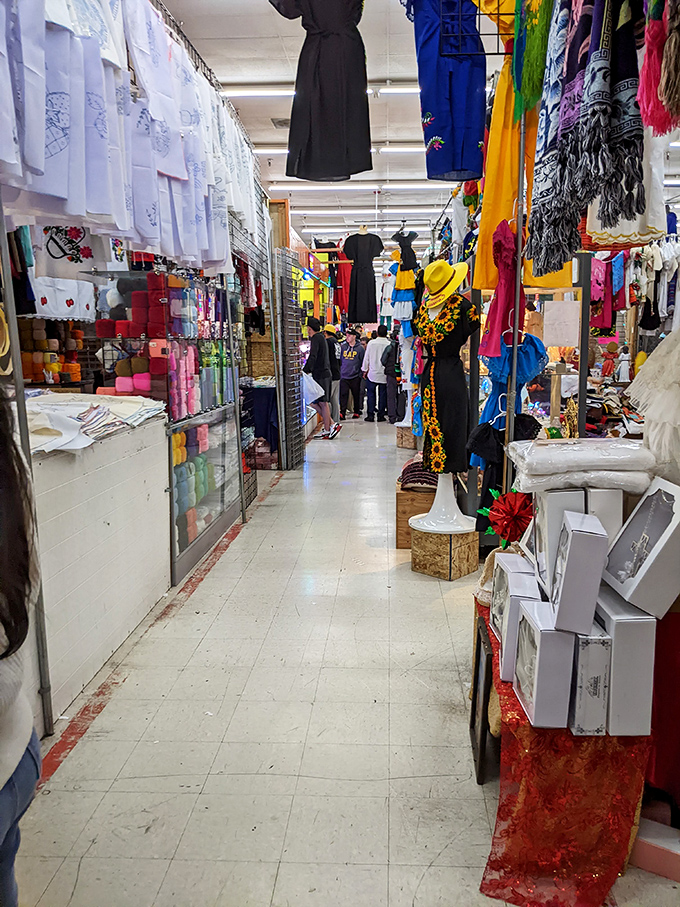 Narrow pathways lead to fashion discoveries where embroidered treasures and colorful fabrics create a textile wonderland worth getting lost in. 