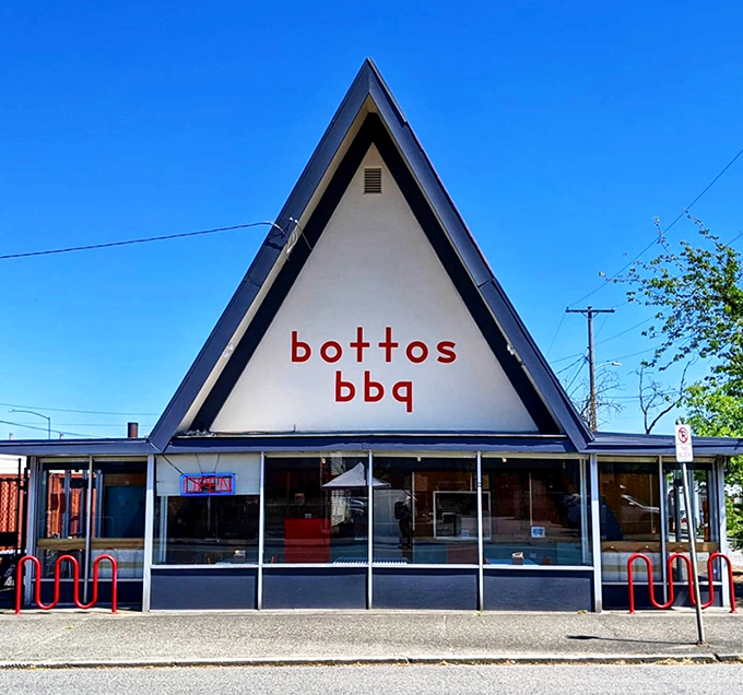 The A-frame architecture isn't just eye-catching—it's a smoke signal to barbecue lovers that something magical awaits inside this Portland landmark.