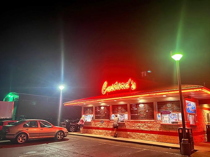 The neon glow of Custard's against a twilight sky isn't just signage—it's a beacon of hope for dessert lovers seeking frozen nirvana.