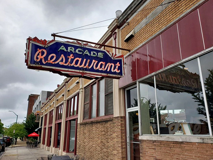 The neon sign beckons like an old friend – The Arcade Restaurant stands proudly on South Main Street, Memphis's oldest diner still serving up history with breakfast.