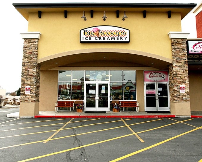 The cheerful yellow exterior of Big Scoops beckons like a dessert lighthouse, complete with welcoming benches where you can savor your frozen treasures in the Utah sunshine.