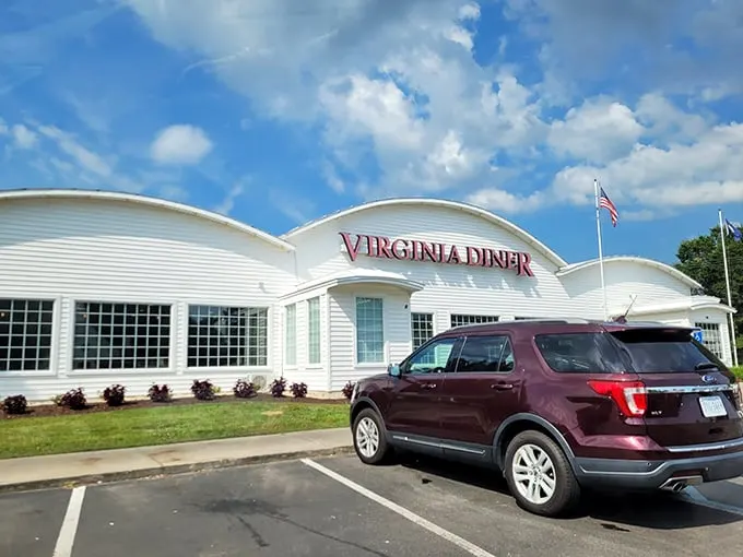 The white curved exterior of Virginia Diner stands proudly against the blue Virginia sky, a beacon of comfort food that's been calling hungry travelers home for generations.