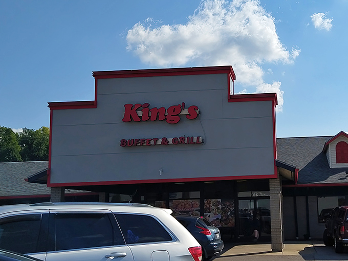The unassuming exterior of King's Buffet & Grill hides a culinary wonderland within—like finding Narnia in a strip mall.