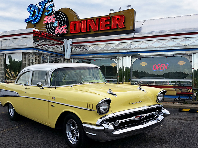 The gleaming silver exterior of DJ's isn't just a diner—it's a time machine with neon signs instead of buttons and dials.