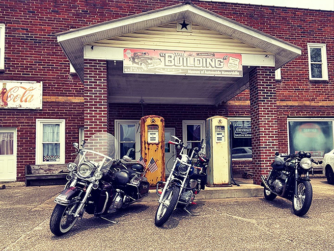 The brick facade of "The Building" with its vintage gas pumps standing guard feels like a time portal to America's automotive golden age.
