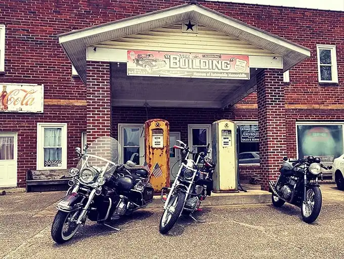 The brick facade of "The Building" with its vintage gas pumps standing guard feels like a time portal to America's automotive golden age.