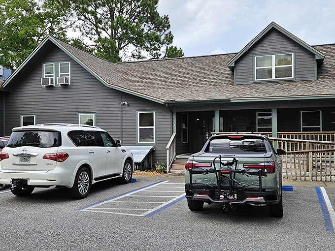 The unassuming gray exterior of The Boathouse Landing might fool you, but locals know this weathered facade hides culinary treasures worth discovering.