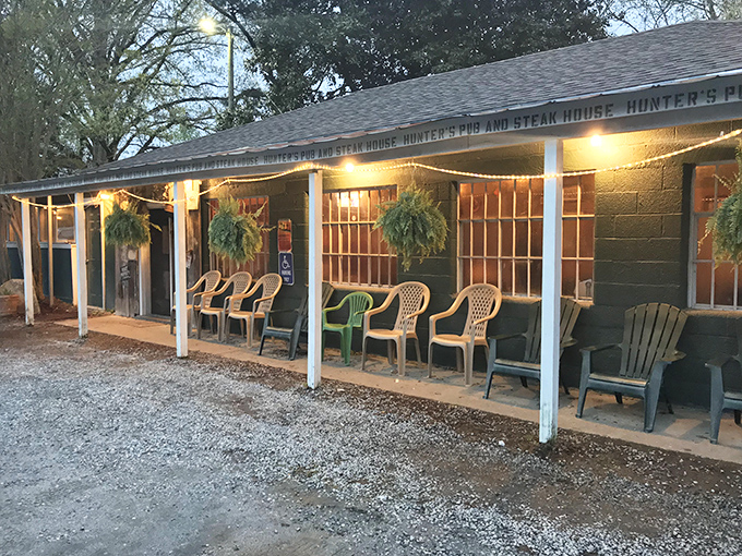 The unassuming exterior of Hunters Pub might fool you—but those hanging flower baskets and packed porch are telltale signs of culinary greatness within.