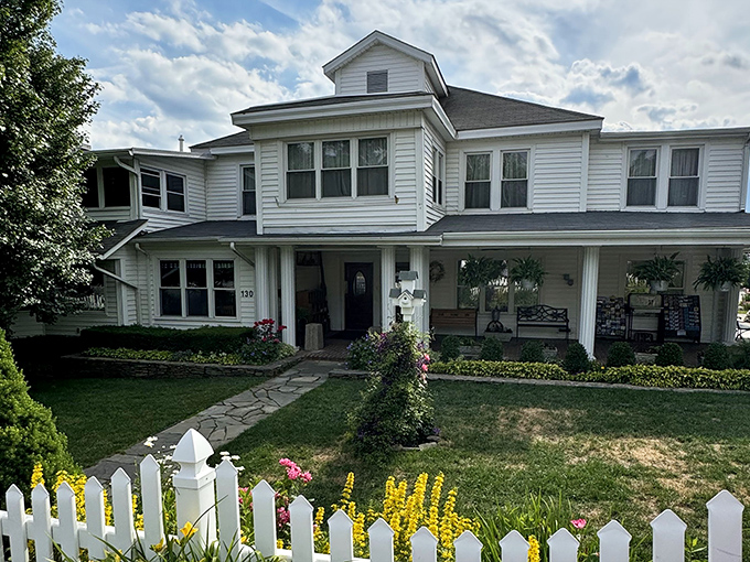 The unassuming white exterior of Dan'l Boone Inn belies the culinary treasures within—like finding a Broadway show in a barn.