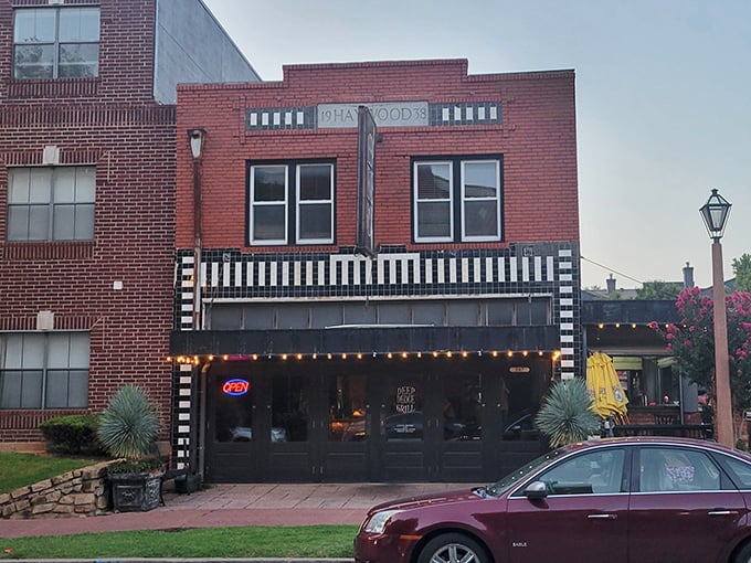 The iconic Deep Deuce Grill sign beckons hungry travelers like a lighthouse for comfort food. Those string lights aren't just decoration—they're a promise of good things to come.