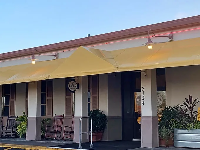 The unassuming yellow exterior of Fred's Market Restaurant hides a Southern food paradise within. Those rocking chairs aren't just for show—they're recovery zones between helpings.