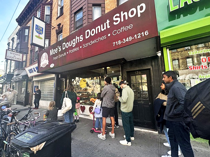 The unassuming burgundy awning of Moe's Doughs stands as Brooklyn's sweetest secret hiding in plain sight, complete with vintage charm and bicycles parked hopefully nearby.