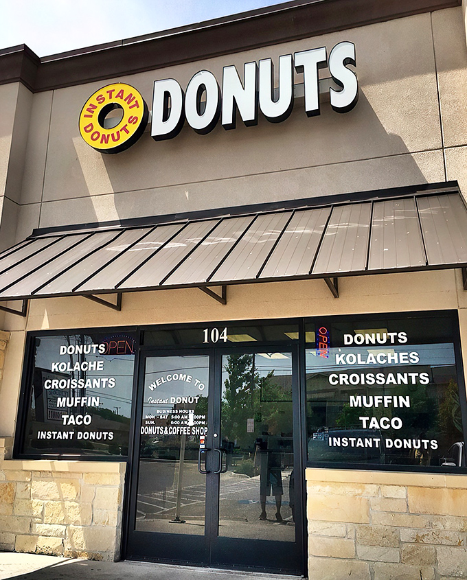 The unassuming yellow and white sign of Instant Donuts beckons from its strip mall home—proof that culinary treasures often hide in plain sight.