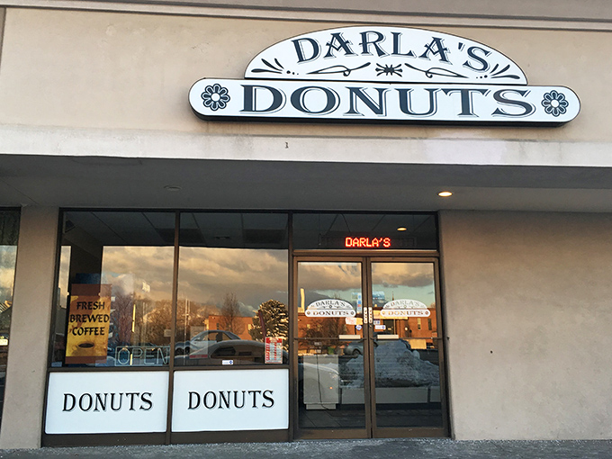 The unassuming storefront of Darla's Donuts stands like a beacon of hope for the sugar-deprived. No fancy frills, just the promise of donut perfection within.