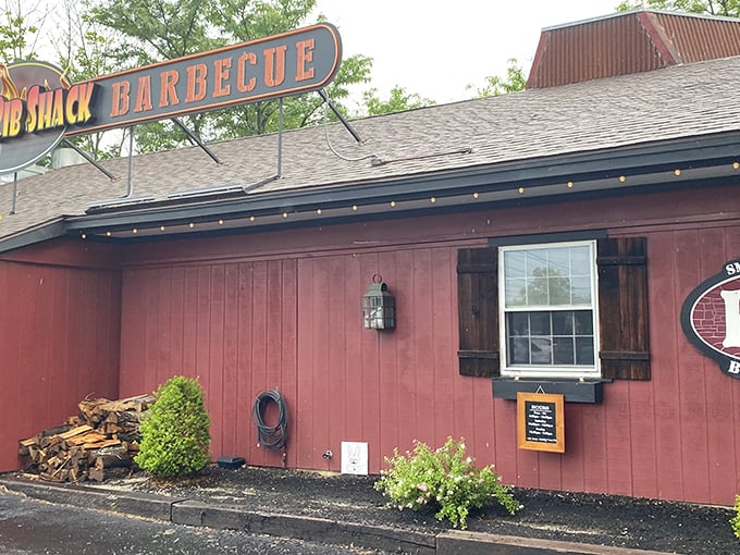 The red barn exterior of KC's isn't trying to impress you—until you step inside and the BBQ aroma makes your knees weak.
