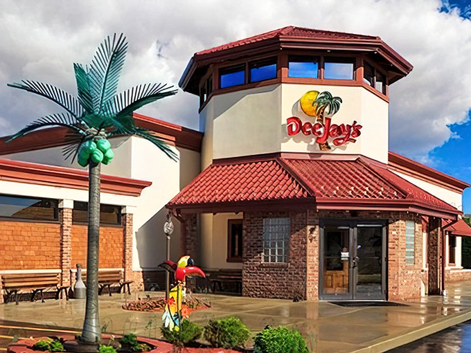 That iconic tower with its sunny yellow logo and palm tree is like a lighthouse for hungry souls—guiding barbecue pilgrims home through the West Virginia hills.