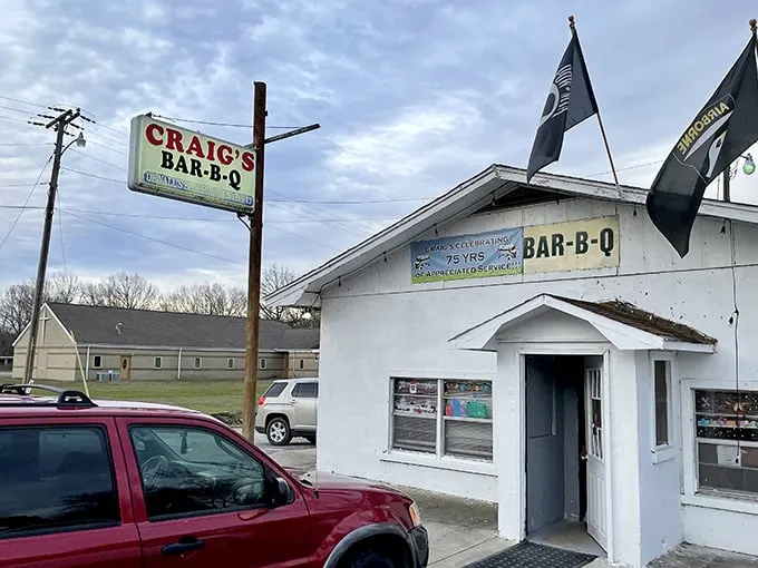 The unassuming white building with its vintage sign promises more than meets the eye. Barbecue pilgrims know: the humbler the exterior, the better the meat inside.