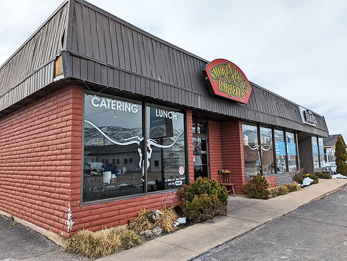 The unassuming exterior of Smokin Bones BBQ stands like a beacon of hope for hungry travelers, promising smoky delights within those brick walls.