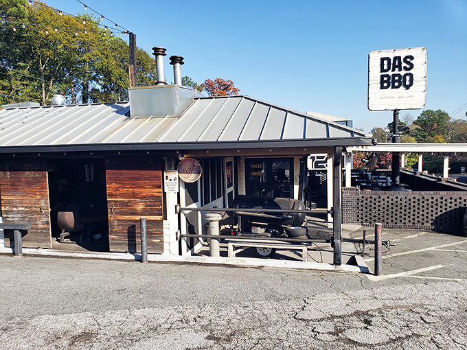 That classic barbecue joint exterior promises serious smoky business happening inside those welcoming doors.