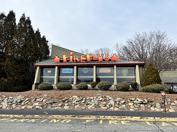 The bright orange Firefly's sign beckons like a barbecue lighthouse, promising smoky salvation to weary travelers on the Marlborough roadside.